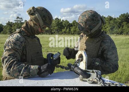 U.S. Marine Corps Pfc. Tristan Doran poses for a photo with his family ...