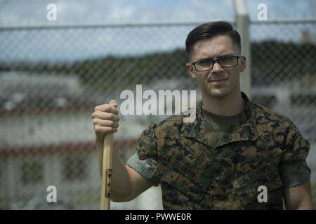 U.S. Marine Cpl. Christopher Ehms receives a Navy Achievement Medal ...