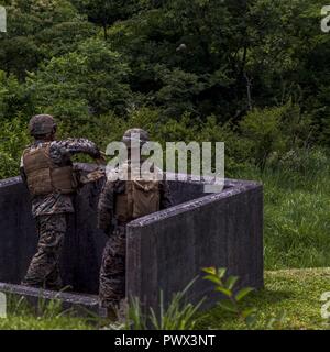 A U.S. Soldier throws the M67 grenade during the weapons lane, to earn ...