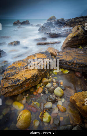 Colourful stones along shoreline in Costa Rica Stock Photo - Alamy