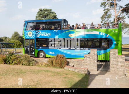 A Purbeck Breezer open top bus picking up passengers at Swanage beach ...