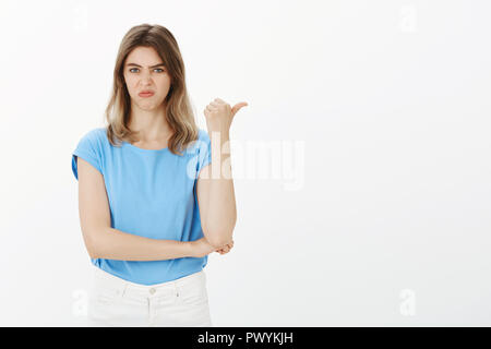Portrait of a disgusted young woman frowning Stock Photo - Alamy