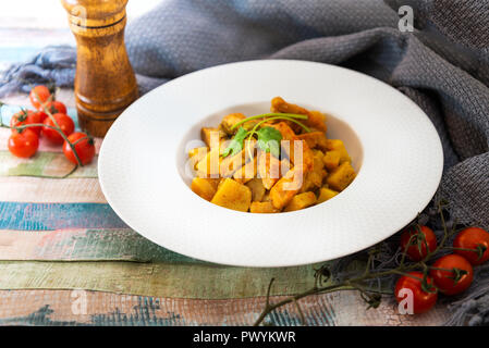 Fresh chicken steak with tomatoes and potatoes Stock Photo - Alamy
