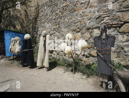 Traditional Georgian shepherd dress, hat or papakha and coat of sheep ...