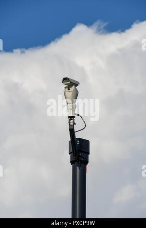 A traffic monitoring camera mounted high above the highway captures the ...