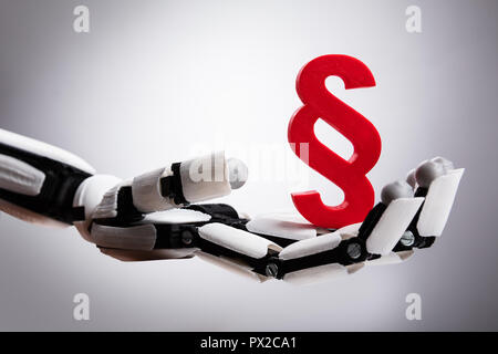 Robot Holding Paragraph Symbol Stock Photo - Alamy