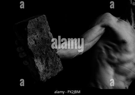 A protesting man throws a brick in black and white Stock Photo - Alamy