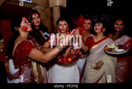 Women seen smearing one another with Sindur during the Sindur Khela ...