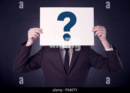 Young businessman hiding behind a question mark drawn on paper Stock ...