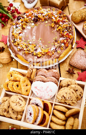 Beautiful different Christmas decorations and gingerbread on a brown ...