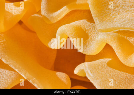 Dry Italian pasta called pantacce on a white background ,rhombus ...