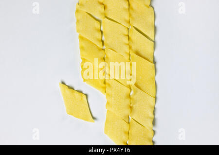 Dry Italian pasta called pantacce on a white background ,rhombus ...