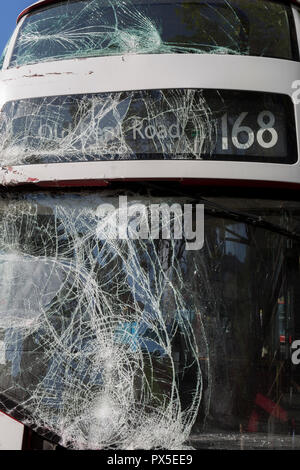 A London bus with a smashed windscreen after it ran into the back of ...