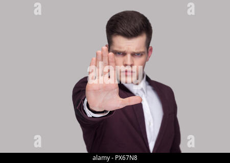 Businessman blocking camera with his hand Stock Photo - Alamy