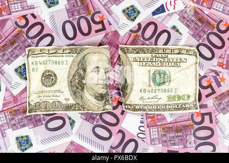 One Hundred Dollar Bill Ripped in Half Isolated on a White Background ...