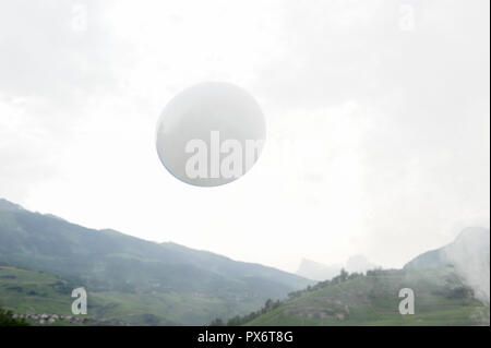 Switzerland, Wallis, artificial white air bubbles from bubble machine ...