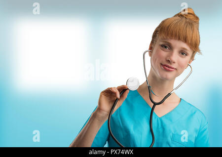 Young redhead doctor woman holding anatomical model of female genital ...