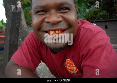 Man with red teeth after chewing betel nuts, Honiara, Solomon Islands ...