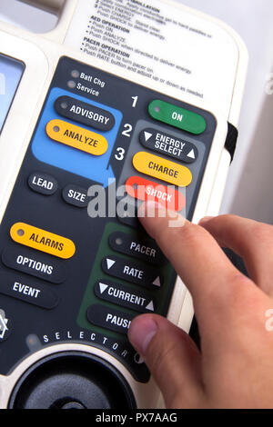 Professional AED, defibrillator buttons close up, modern medical ...