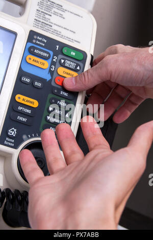 Professional AED, defibrillator buttons close up, modern medical ...