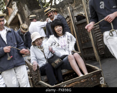 Portugal, Madeira.“Monte sledge” ride from Monte downhill to Funchal ...