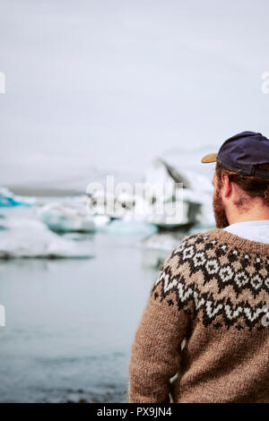 A guide in traditional Viking clothes shows visitors the defence walls ...