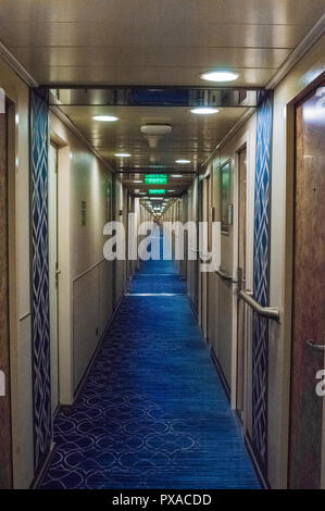 Cruise ship interior showing a long Corridor and doors off to rooms ...
