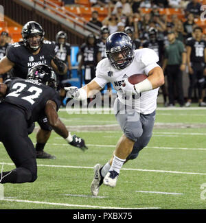 Nevada Wolf Pack running back Vai Taua pushes through the Boise State ...