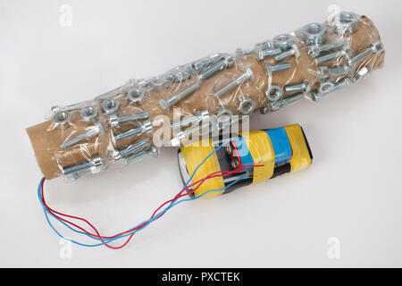 Handmade pipe bomb with cell phone firing device on white background ...