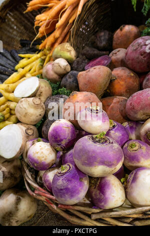 Fresh organic turnips in basket at market stall, La Boqueria Market ...