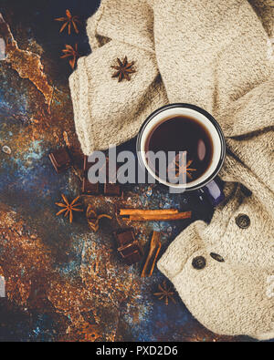 Blue sweater and cinnamon sticks and anise star. Dry slices of citrus ...