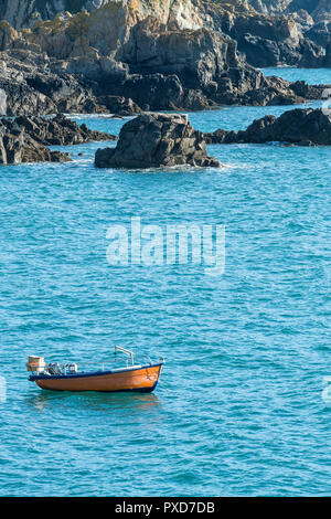 A fisherman is riding a boat on a beach in Batam Stock Photo - Alamy