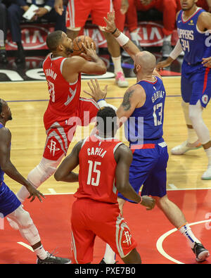 Houston Rockets guard Eric Gordon, right, pulls in a rebound as Denver ...