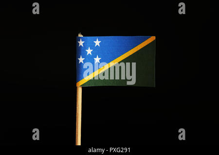 Flag of the Solomon Islands, blue green with a yellow stripe and white ...