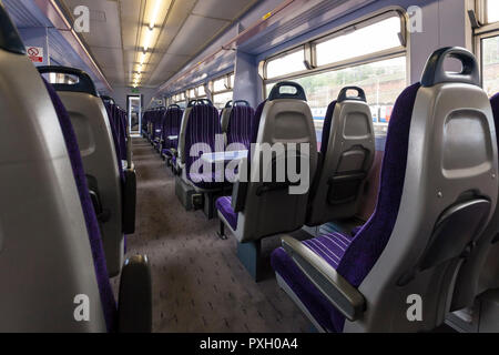 Seating and aisle of an empty railway carriage interior of a Northern ...