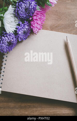 Blank brown notebook with autumn flowers Stock Photo - Alamy