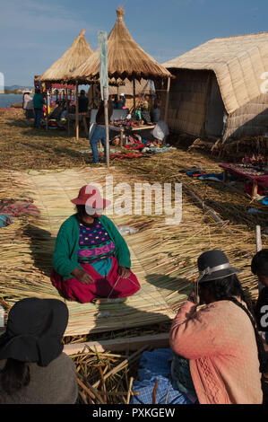 Visiting Uros floating islands Stock Photo - Alamy