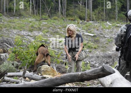A cadaver dog searches a field for planted body parts from a North ...