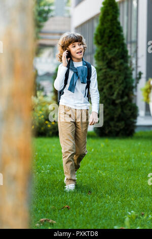 Adorable caucasian boy student holding test tube at classroom Stock ...