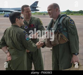 U.S. Army Lt. Col. Miguel Cisneros, right, welcomes U.S. Soldiers ...