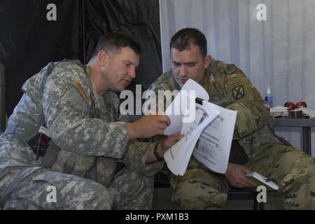 U.S. Army Maj. Jacob Roy, left, Headquarters, Headquarters Company ...