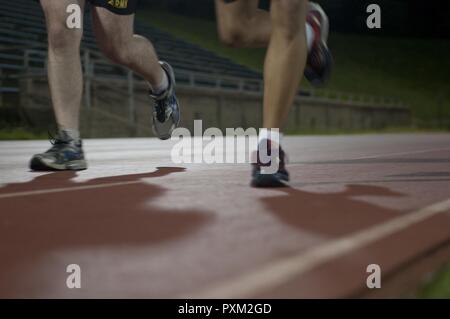 Warriors participate in the 2-mile run event as part of the Army ...