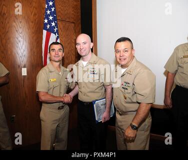 Marines of the support staff at the Amphibious Warfare School gather ...