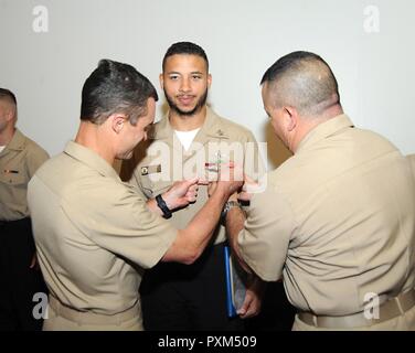Marines of the support staff at the Amphibious Warfare School gather ...