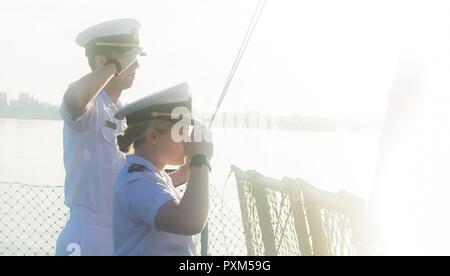 Naval Academy midshipman salute during the National Anthem, prior to ...