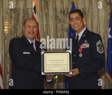 Lt. Gen. Giovanni Tuck, Eighteenth Air Force commander, presents a ...