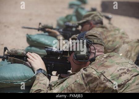 An Iraqi soldier fires his M4 rifle during a live fire exercise at the ...
