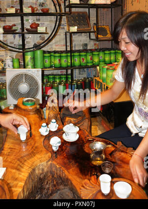 Woman serving Chinese tea in a traditional tea ceremony Stock Photo ...