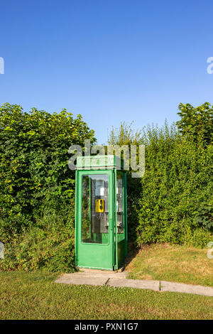 Green painted telephone box on a campsite in Wales UK Stock Photo - Alamy