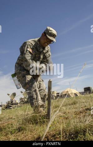 A high-capacity line-of-sight antenna mast hovers over Forward ...